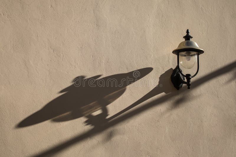 Old Street Lamp with Long Shadow on the Wall Stock Image - Image of ...