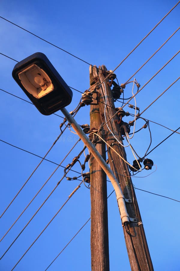Old Street Lamp with Power Cables in Warm Evening Light Stock Photo ...