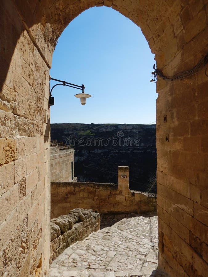 An Old Street Lamp Seen through a Stone Archway Stock Photo - Image of ...