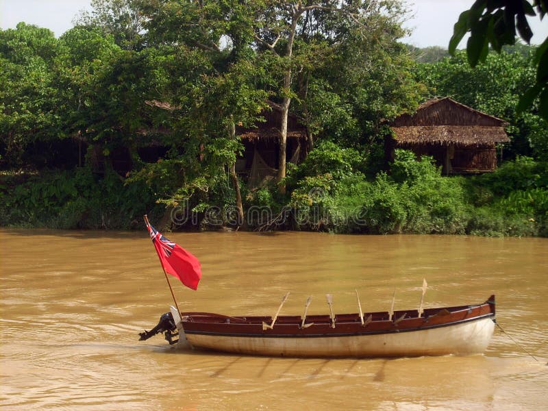 Old Style Boat with Flag at Muddy River Stock Photo - Image of style ...