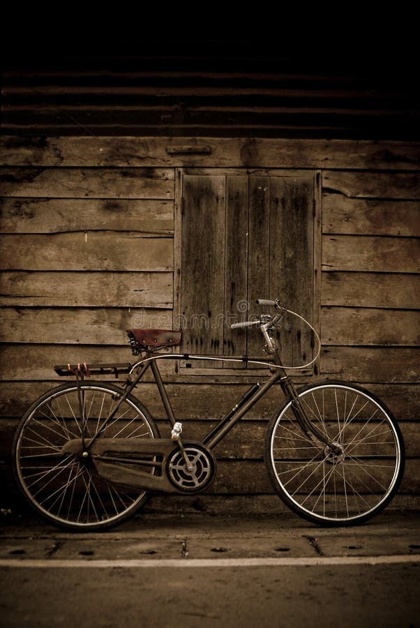 Old Style Brown Bicycle and Wood Door Stock Image - Image of ...
