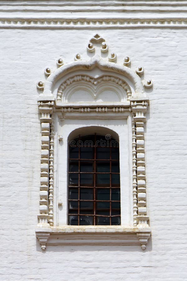 Old Style Castle Window with Rich Stone Decorations on the White Wall ...