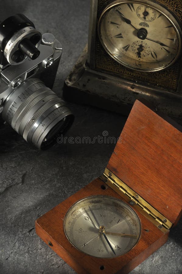 Old Style Photograph Camera and Compass Stock Image - Image of vertical ...