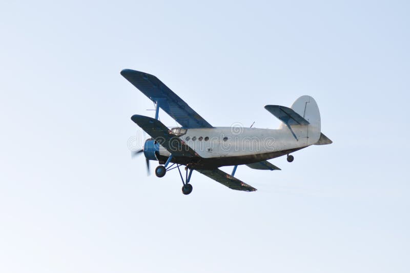 Old Plane Flying and Spraying the Crops Stock Photo - Image of cloudy ...