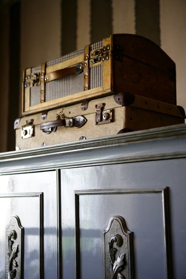 Old Suitcases Over the Wardrobe Stock Photo - Image of glamour, retro ...