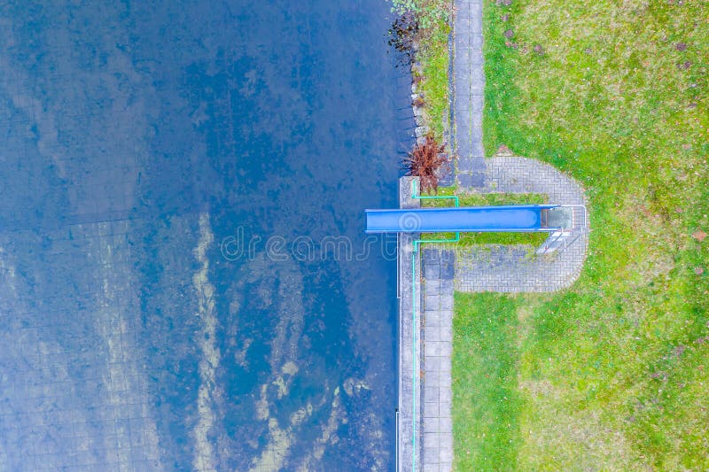 Old Swimming Pool with a Slide from Above Stock Photo - Image of green ...
