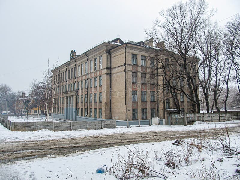 An Old Symmetrical Brickstone Building during Winter, Covered in Snow ...
