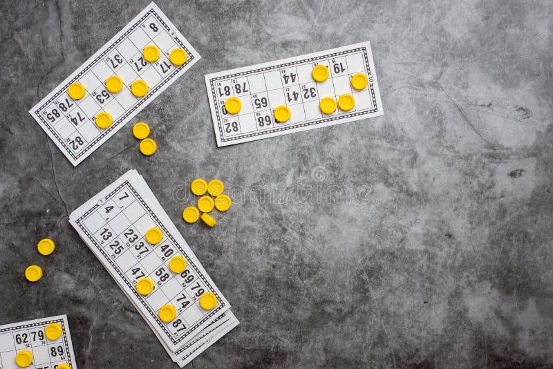 Old Tabletop Game Lotto. Cards Bingo and Yellow Game Chips with Numbers ...