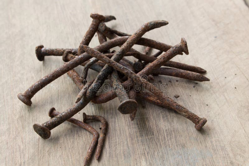Old Tack with Rust on Wooden Stock Photo - Image of instrument, tool ...