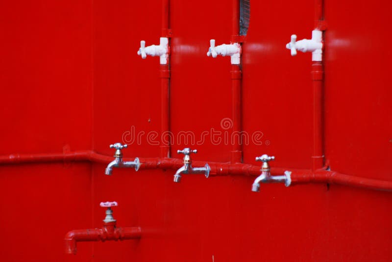 Old tap on a red stock photo. Image of flowing, faucet - 63187424