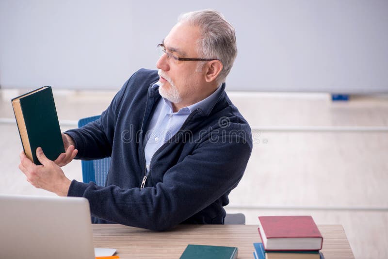 Old Male Teacher in the Classroom Stock Photo - Image of explaining ...