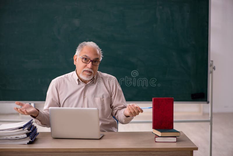 Old Male Teacher in Front of Green Board Stock Image - Image of books ...