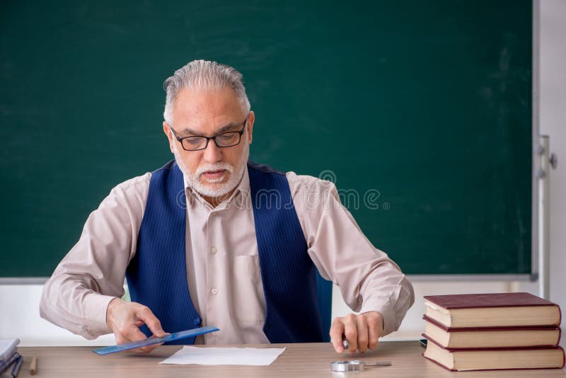Old Male Teacher in Front of Green Board Stock Photo - Image of ...