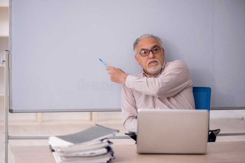 Old Male Teacher in Front of Whiteboard Stock Photo - Image of pointing ...
