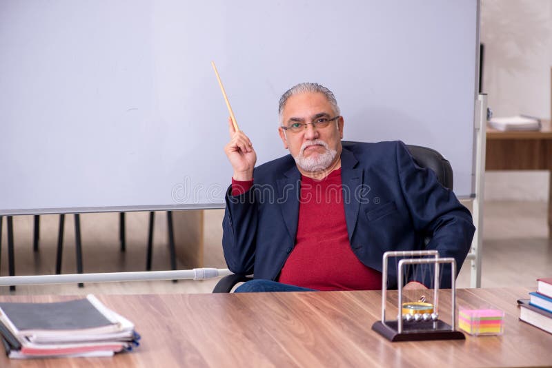 Old Teacher Physicist Sitting in the Classroom Stock Photo - Image of ...