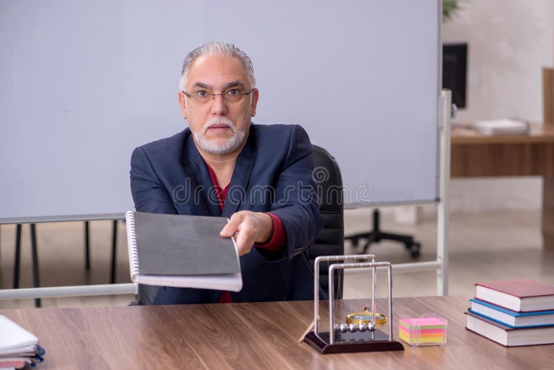 Old Teacher Physicist Sitting in the Classroom Stock Photo - Image of ...