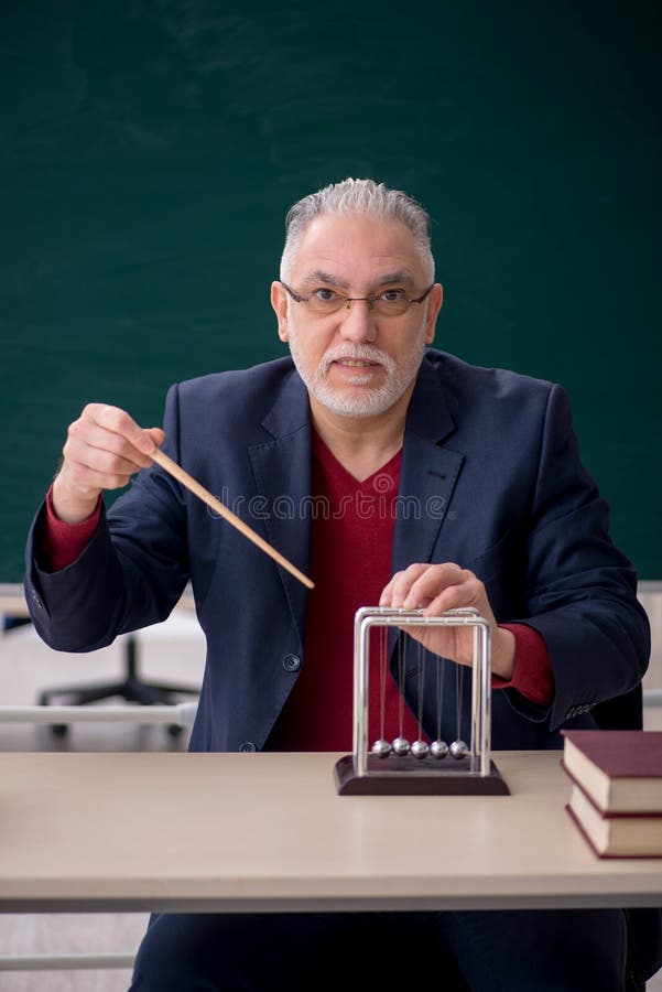 Old Male Teacher Physicist Sitting in the Classroom Stock Image - Image ...