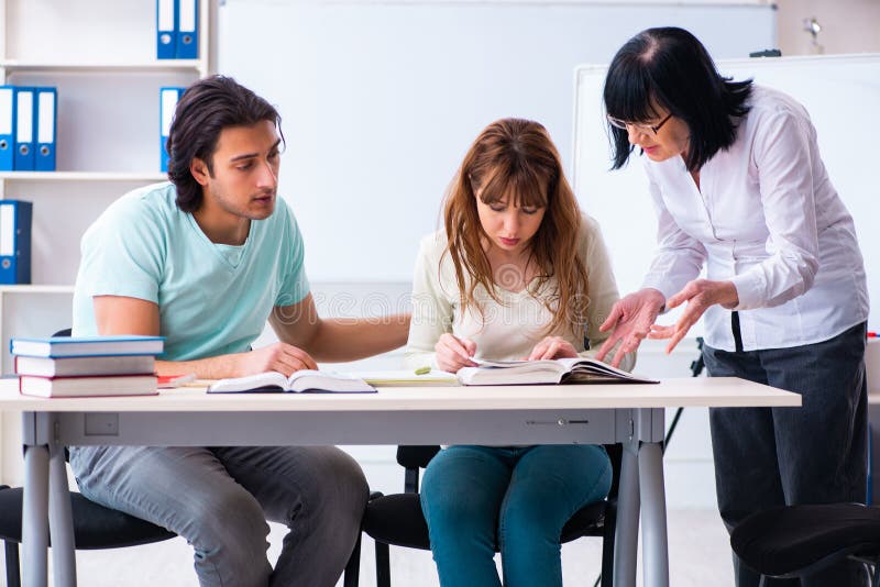 The Old Teacher and Students in the Classroom Stock Photo - Image of ...