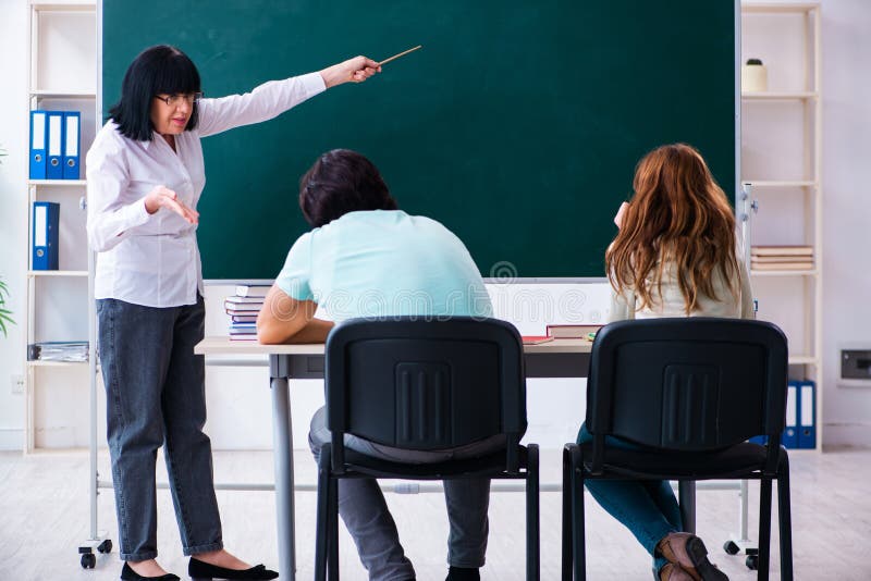 The Old Teacher and Students in the Classroom Stock Image - Image of ...