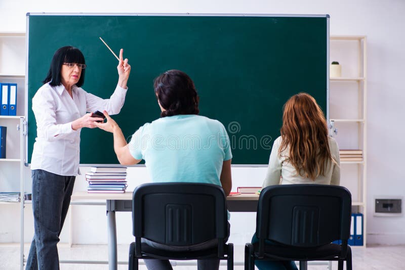 Old Teacher and Students in the Classroom Stock Photo - Image of ...