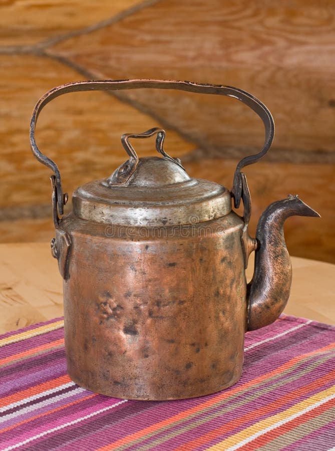 Old teapot on the table. stock photo. Image of logs, domestic - 13853330