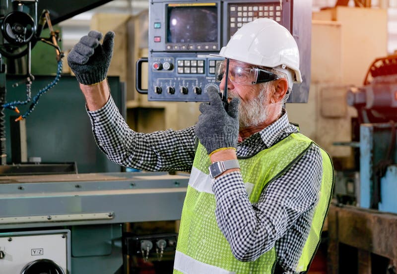 Old Technician Man Work in Factory and Call for Support of Machine ...