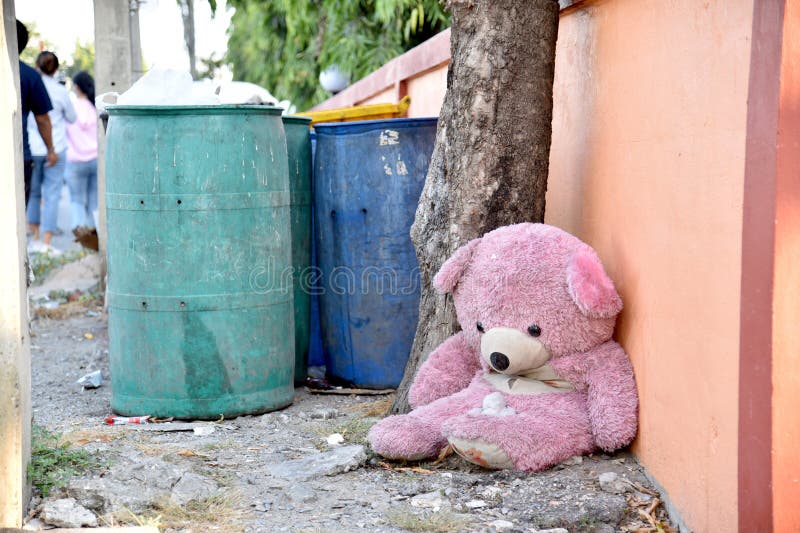 An Old Teddy Bear Was Left Next To a Pile of Garbage. Stock Photo ...