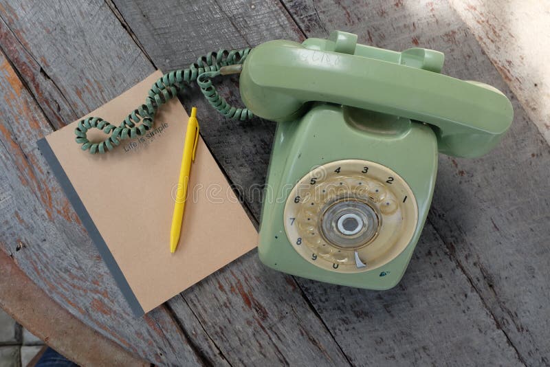 Old telephone and notebook stock photo. Image of history - 66076746