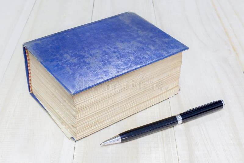 Old Thick Book Blue Cover and Pen on White Background Stock Photo ...