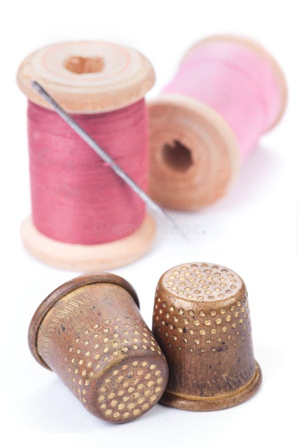 Old Thimbles and Needle with Pink Thread Stock Image - Image of thread ...