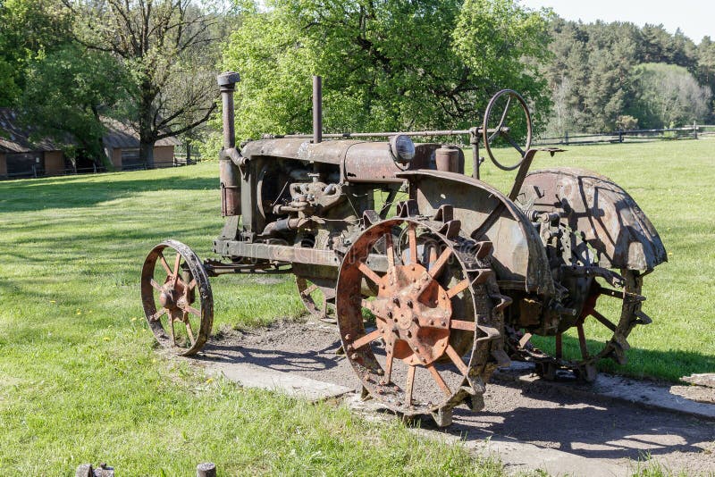 Old-time iron tractor stock image. Image of agricultural - 121547513