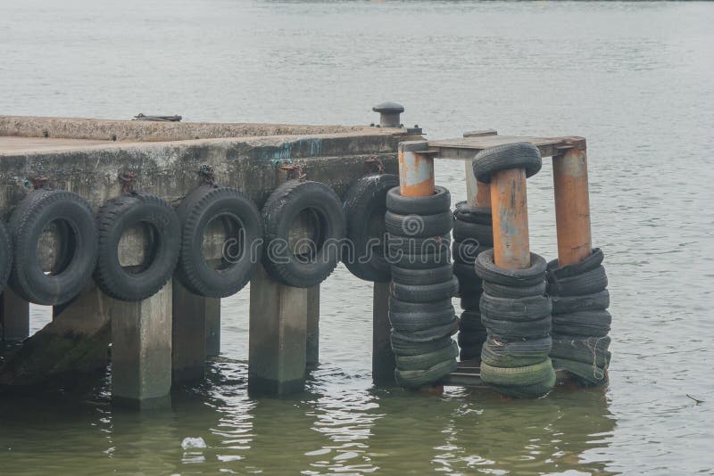 Old tire in the river stock image. Image of pollution - 11005037