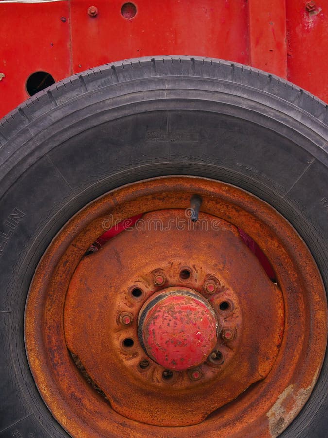 Old Tire and Wheel Painted a Bright Red Stock Photo - Image of decay ...