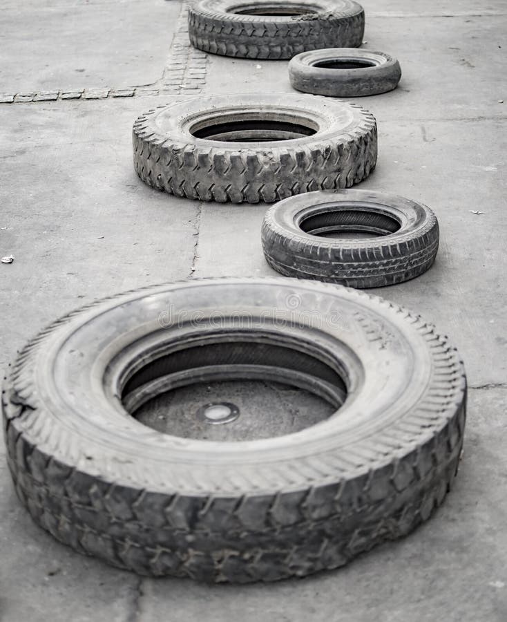 Old tire wheels stock photo. Image of ground, stack, wheel - 61694894