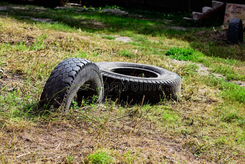 Old Tires in the Backyard. Repurpose and Reuse Material. Stock Photo ...