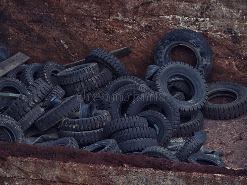 Old Tires in Rusted Container Stock Photo - Image of container ...