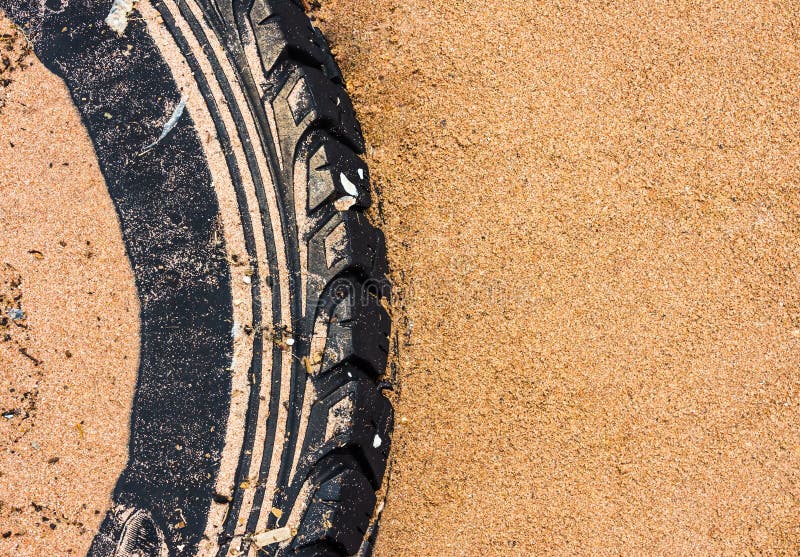 Old tires on the sand stock image. Image of earth, dirt - 58621665
