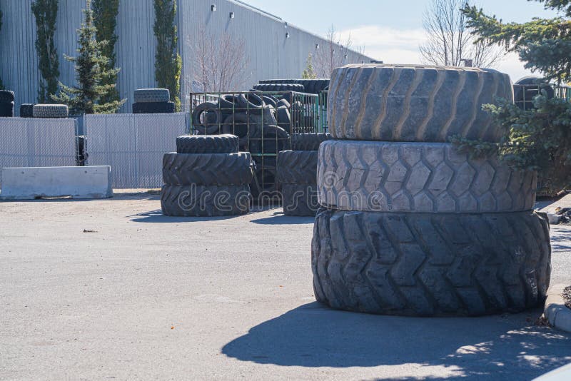 Old Tires Stacked Up Together at a Car Workshop Garage Stock Image ...