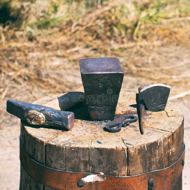 The Old Tools of a Blacksmith on Large Wooden Stump Stock Image - Image ...