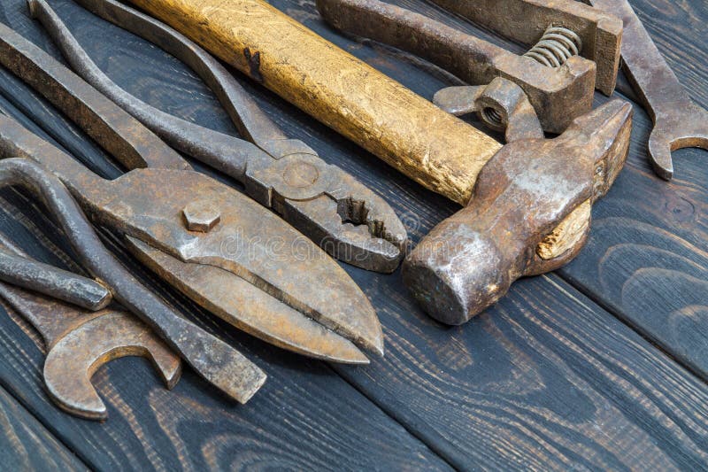 Old Tools Stacked after Work on Black Vintage Wooden Boards Stock Photo ...