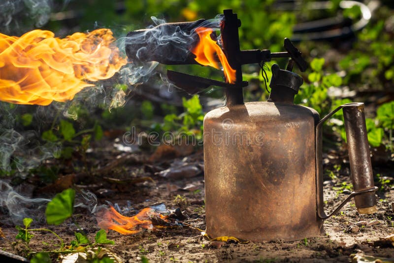 Old torch with a flame stock photo. Image of tool, rust - 129025242