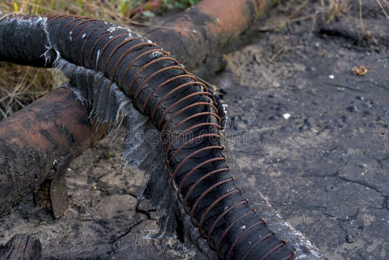 Old Torn Rubber Hose on the Ground Stock Photo - Image of flat, plastic ...