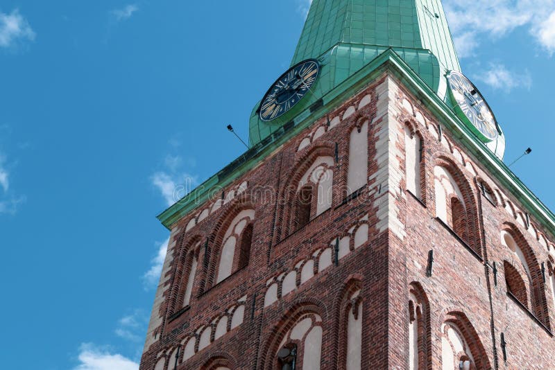 An Old Tower of Red Bricks with a Large Clock Close-up. Blue Sky in the ...