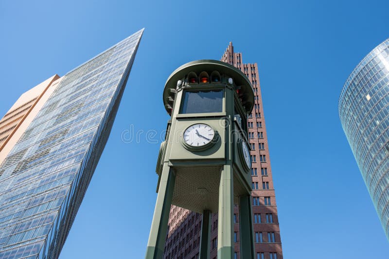 An Old Tower on Which a Clock and a Traffic Light are Located Against ...
