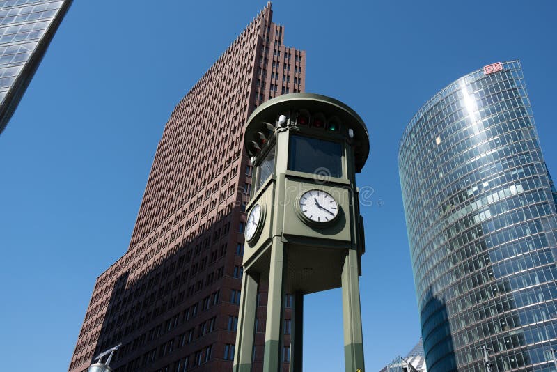 An Old Tower on Which a Clock and a Traffic Light are Located Against ...