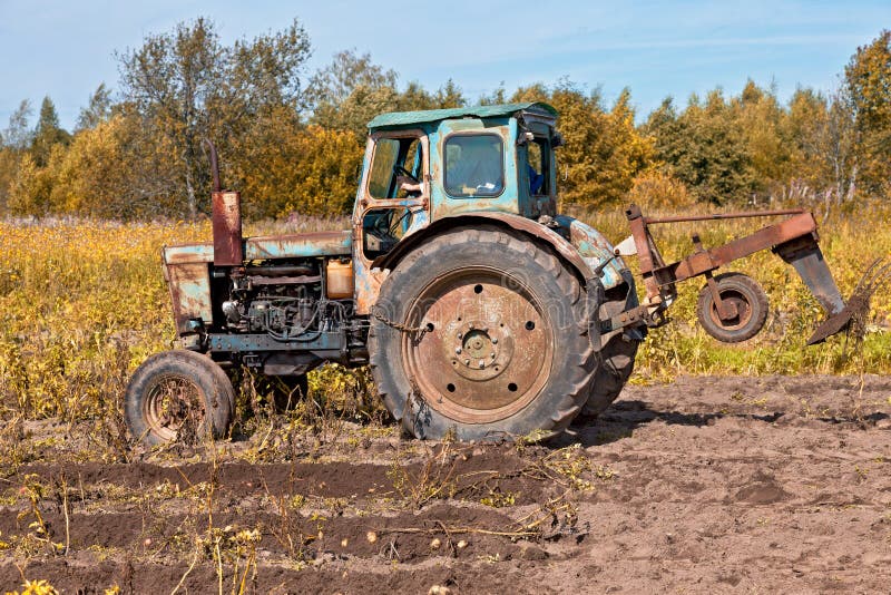 Old tractor at the field stock image. Image of machine - 29808873