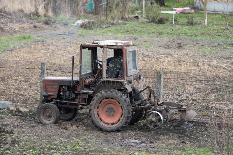 Old Tractor Riding in the Highlands. Agriculture. Stock Photo - Image ...