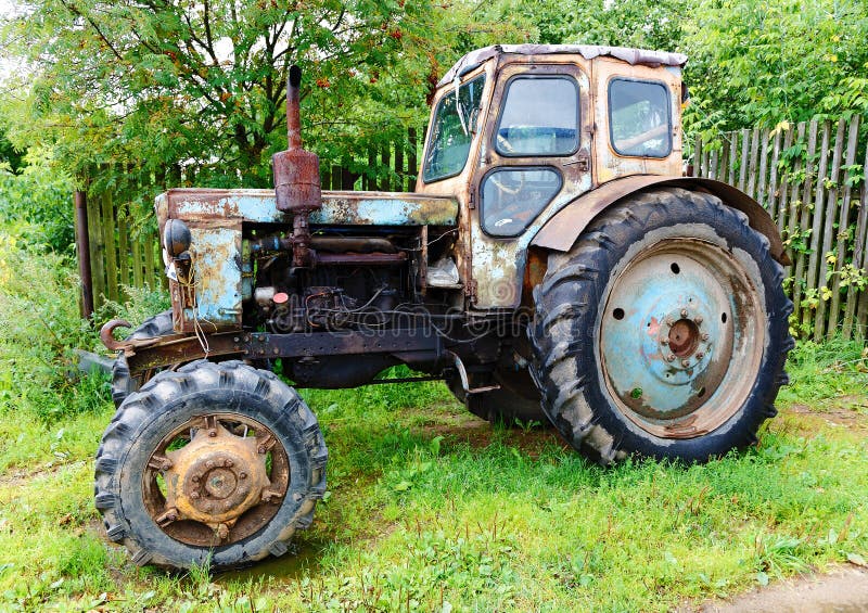 Old tractor in rural stock photo. Image of machinery - 47258662