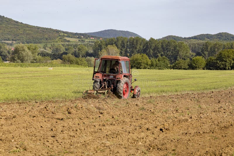 Old Tractor Working on the Field Stock Photo - Image of land, loosened ...