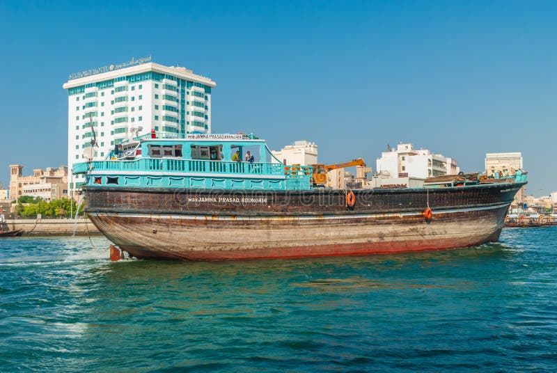 Dubai UAE A Dhow An Old Wooden Sailing Vessel Filled With Cargo Leaves ...